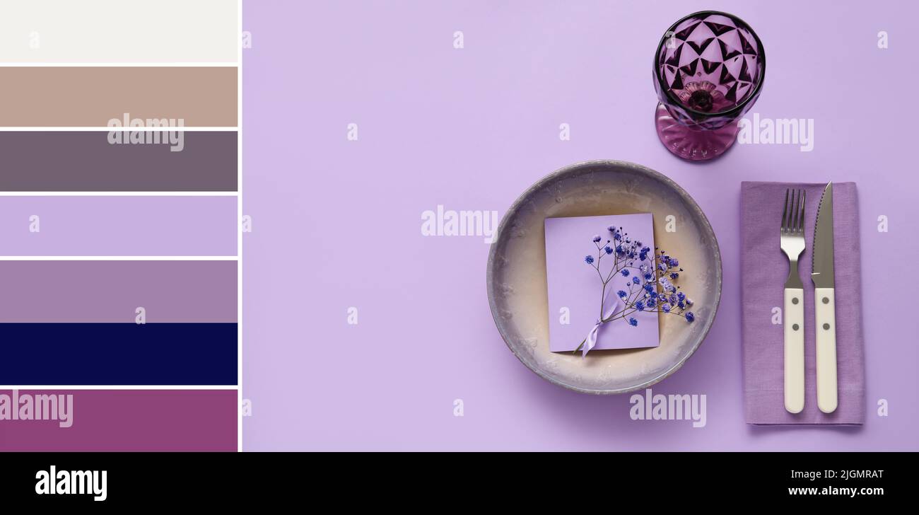 Beautiful table setting on lilac background. Different color patterns ...