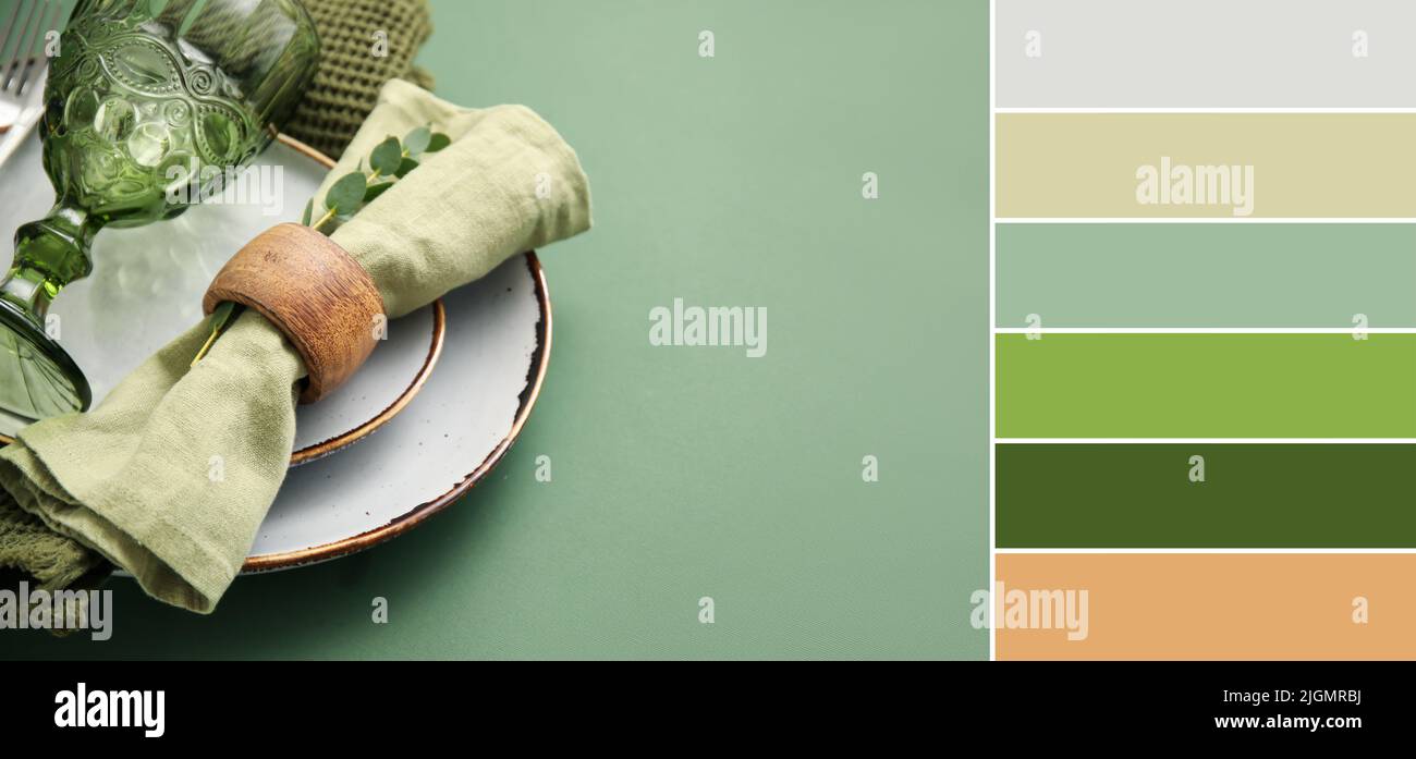 Beautiful table setting on green background. Different color patterns ...