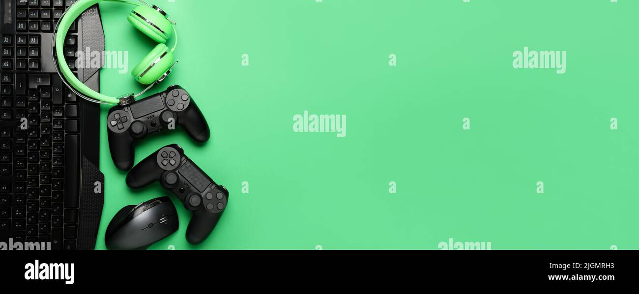 Modern gaming accessories on green background with space for text Stock Photo - Alamy
