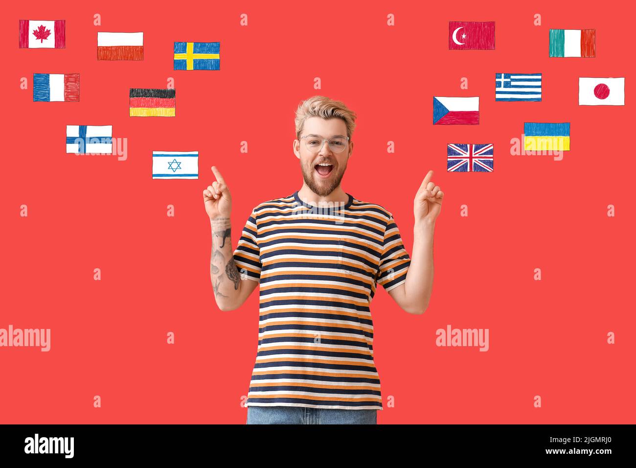 Young man and many different flags on red background. Studying of ...