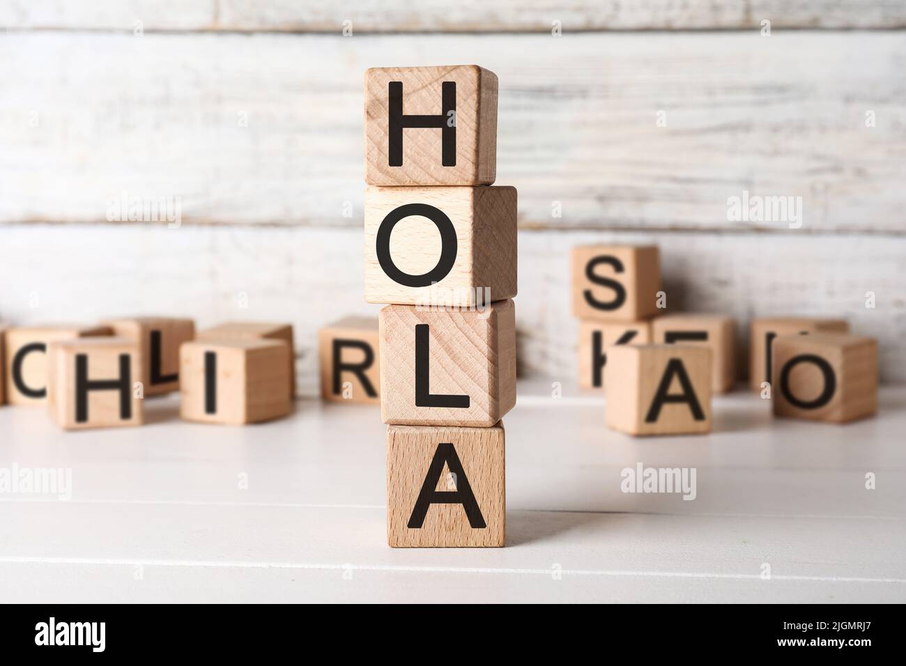 Word HOLA (HELLO) made of wooden cubes on light table Stock Photo - Alamy