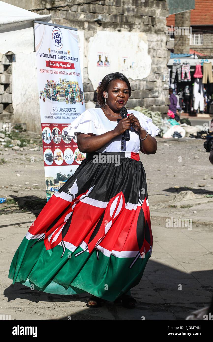 Gospel musician Ann Maina wearing a dress with colors of the Kenyan ...