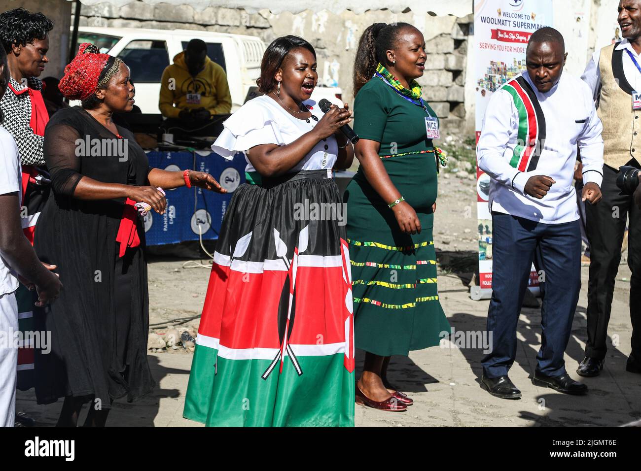 Gospel musician Ann Maina wearing a dress with colors of the Kenyan ...