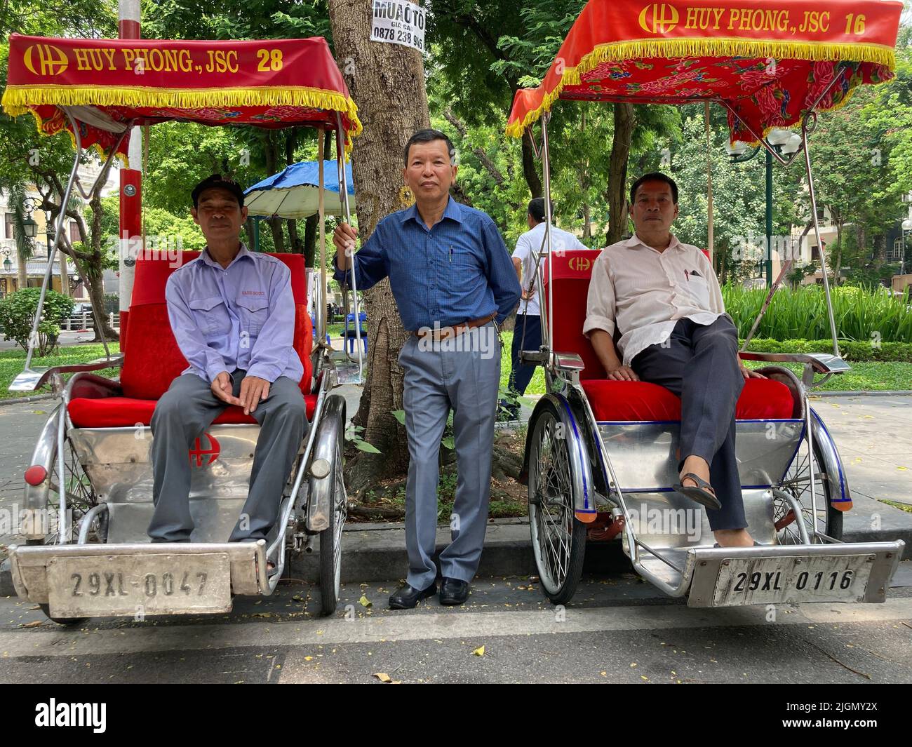 Hanoi, Vietnam. 19th June, 2022. Cyclo driver Tran Viet Dac (l), the ...