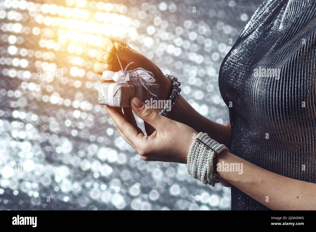 Closeup hands giving surprise gift box Stock Photo - Alamy