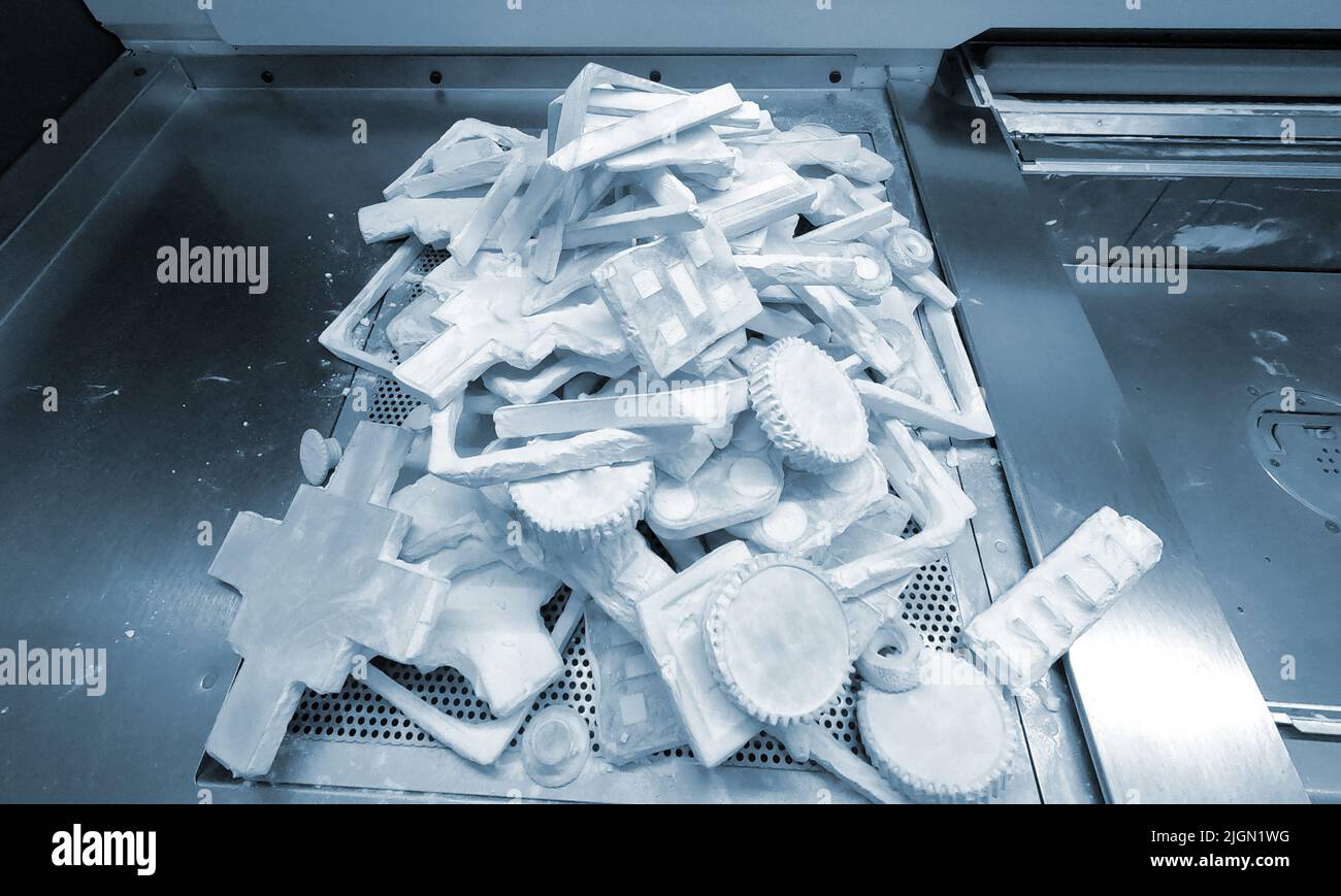 Objects and models printed on industrial 3D printer from white plastic ...