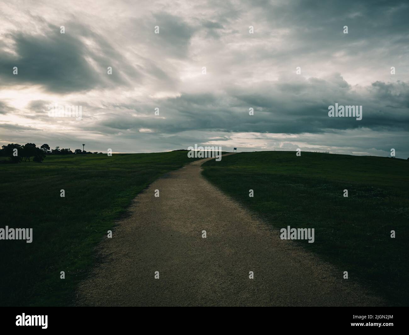 Landscape with a gravel path leading to the horizon Stock Photo - Alamy