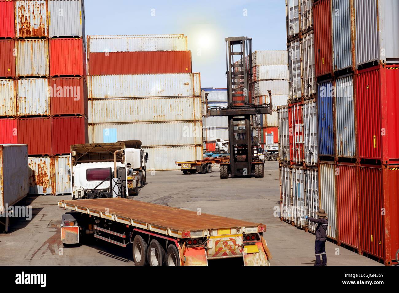 container forklift and load the containers on the truck trailer in the ...