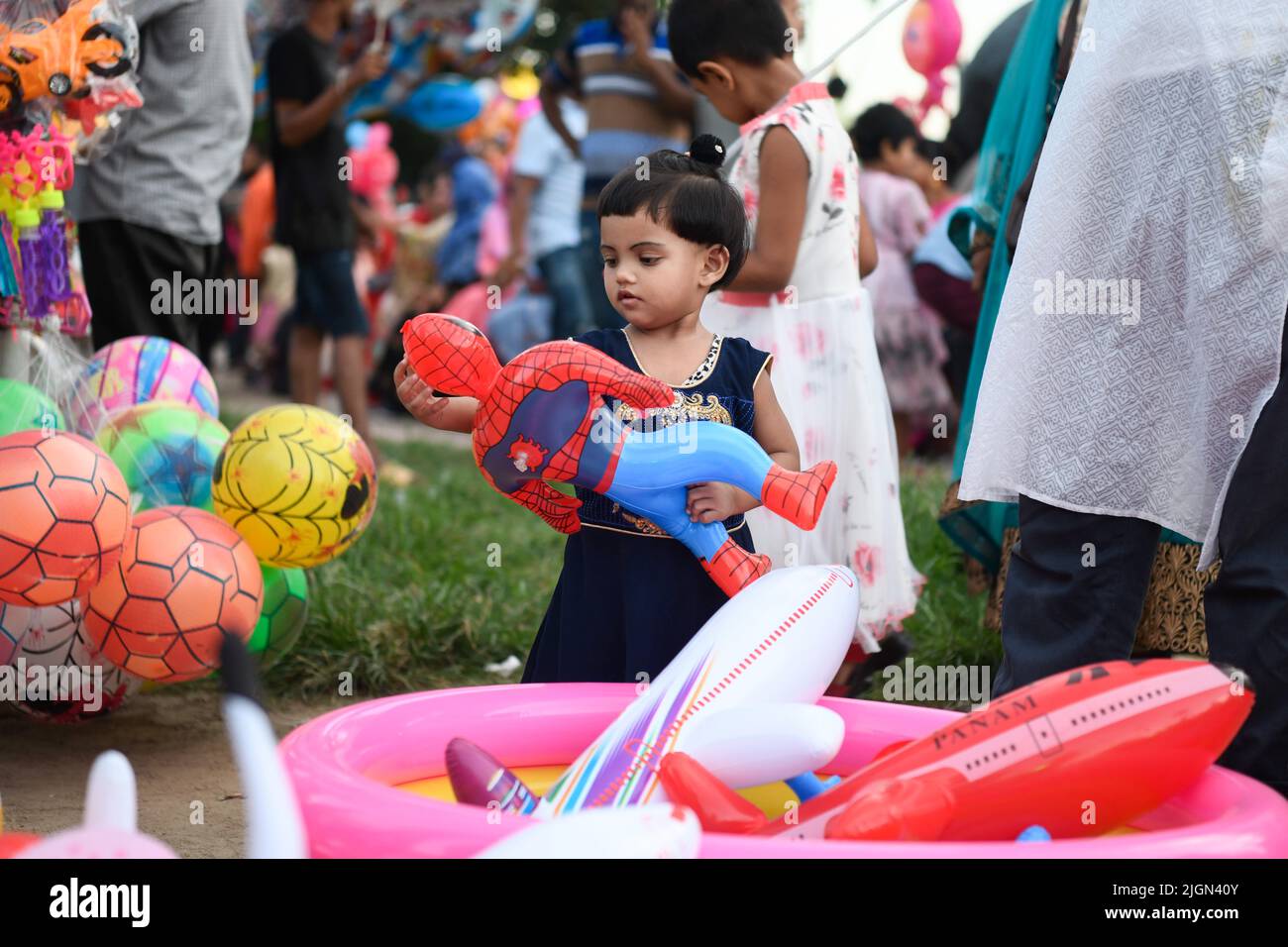 A child is seen with a spiderman toy at Hatirjheel park and during the Eid holidays. (Photo by ...