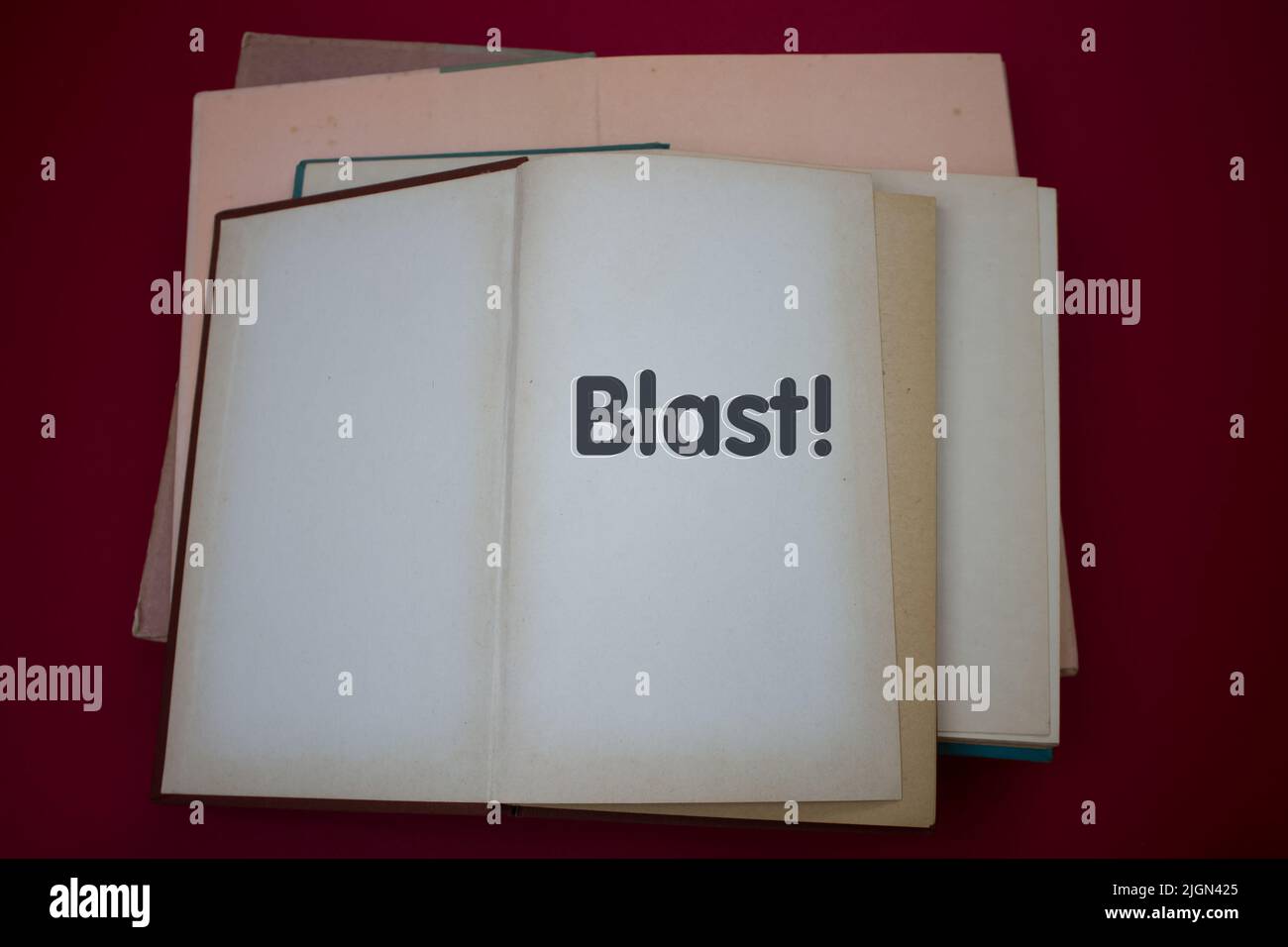 Blast word in opened book with vintage, natural patterns old antique ...