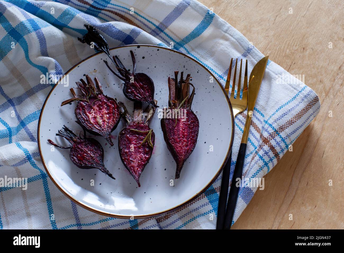 Roasted young half beet with rosemary and sea salt Stock Photo - Alamy