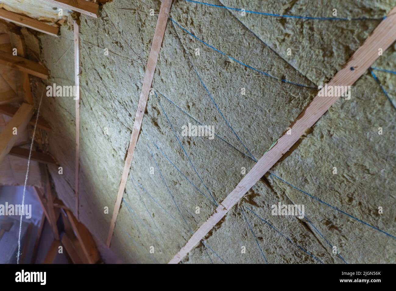 Hemming roof insulation with polypropylene thread Stock Photo - Alamy