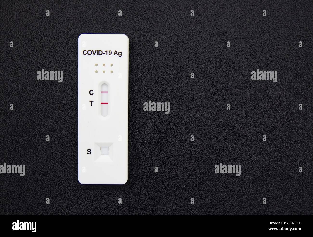 Positive test result of Covid-19 antigen test kit isolated on black ...