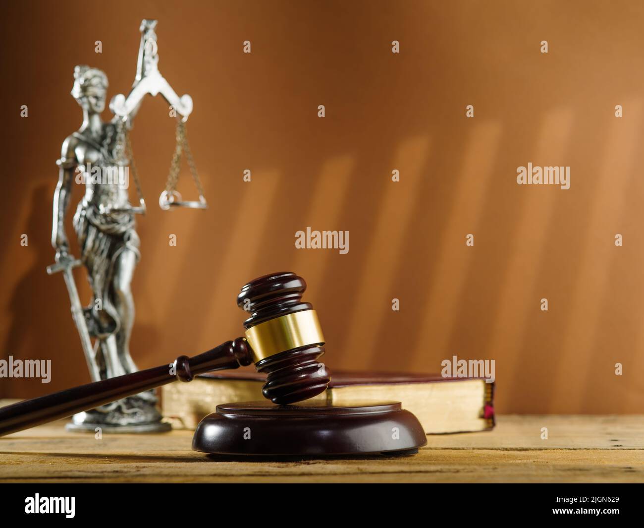 Wooden gavel of the judge, the Constitution and the figure of the ...