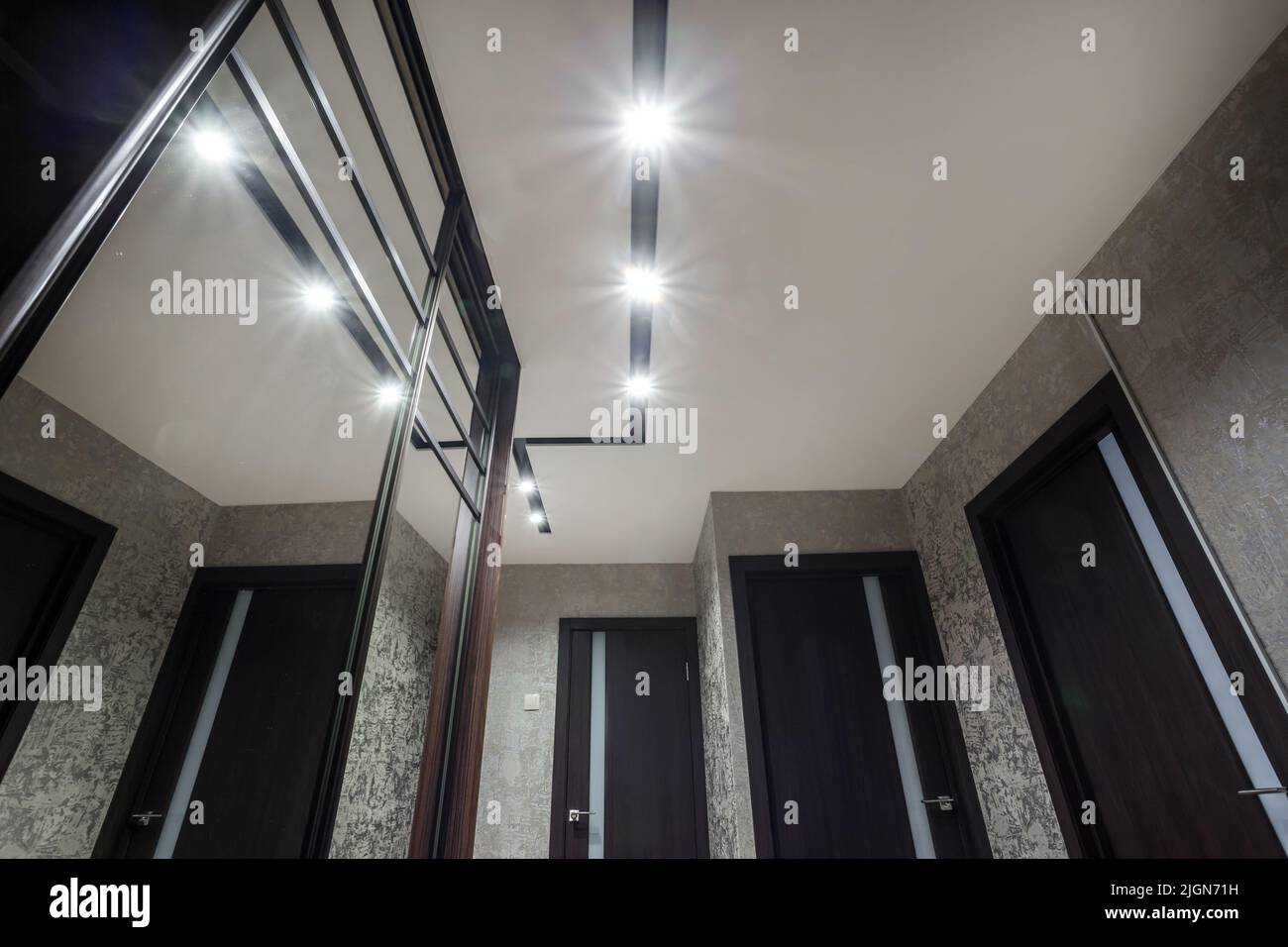 suspended ceiling with halogen spots lamps and drywall construction in ...