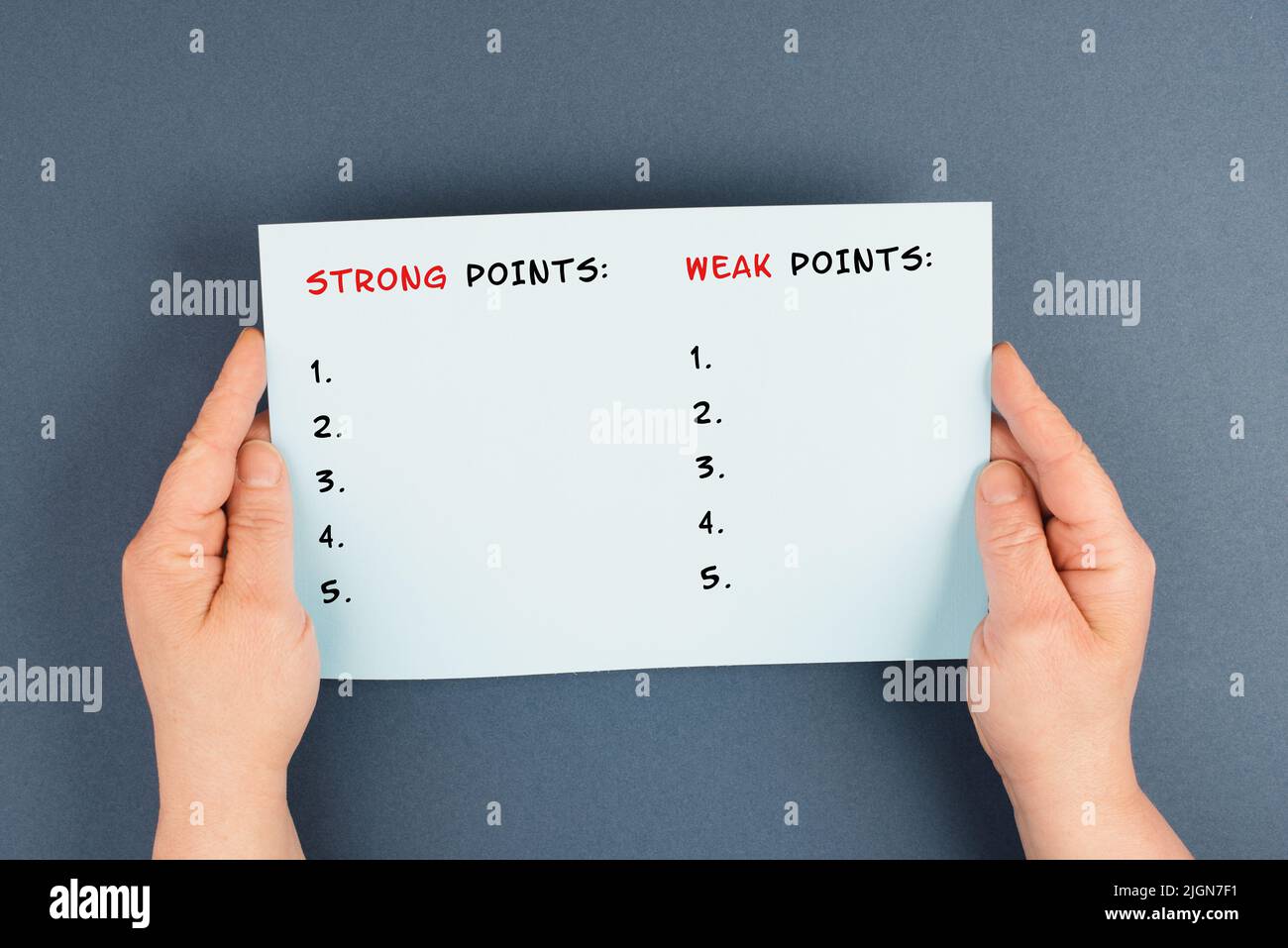 Holding a paper in the hands, list of weak and strong points, analysis ...