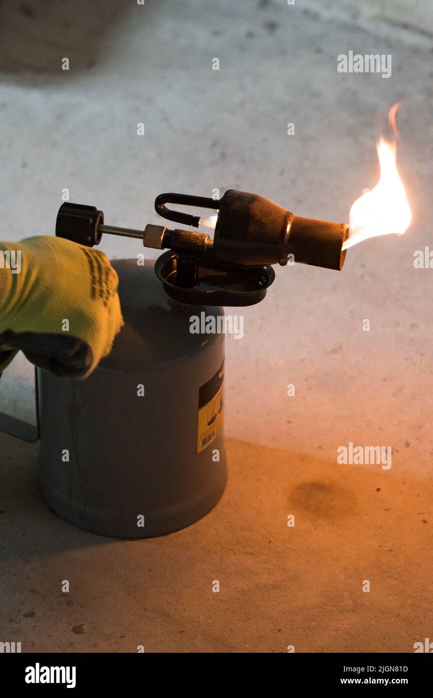 Gasoline blowtorch with a burning fire, the use of a blowtorch in ...