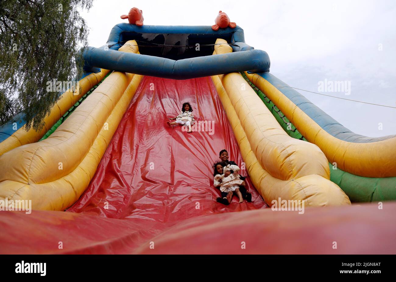 Sanaa, Yemen. 11th July, 2022. Children play at an amusement park ...