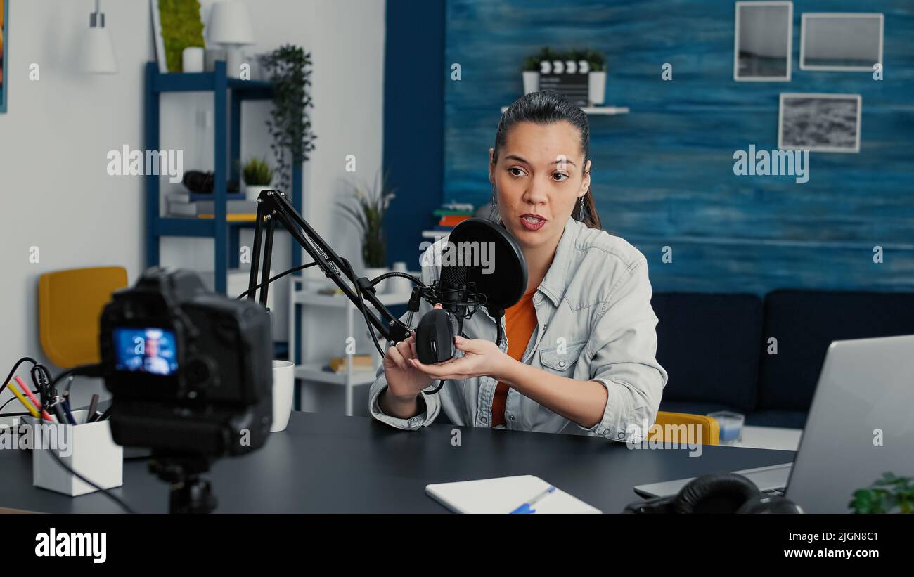 Tech influencer reviewing modern wireless hi-res stock photography and ...