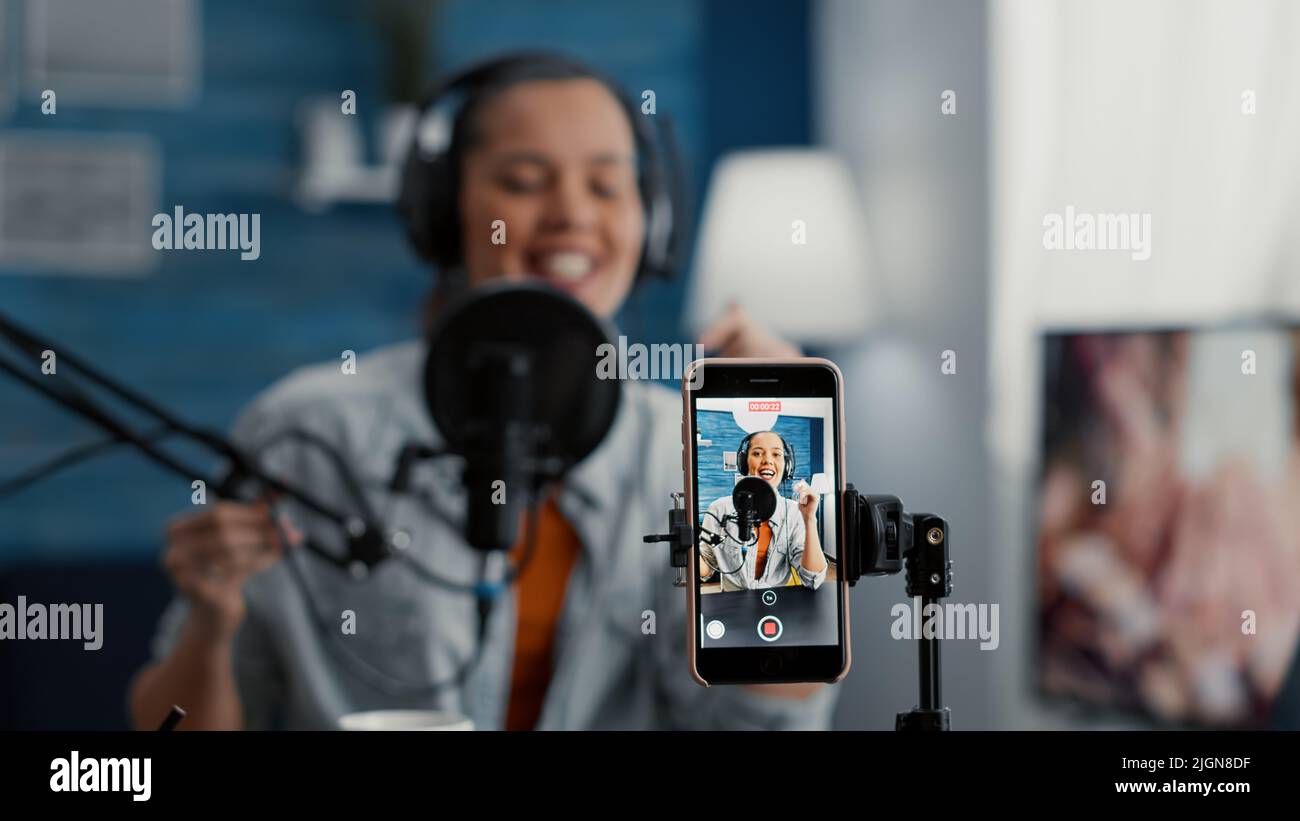 Famous internet influencer filming daily vlog with smartphone while ...