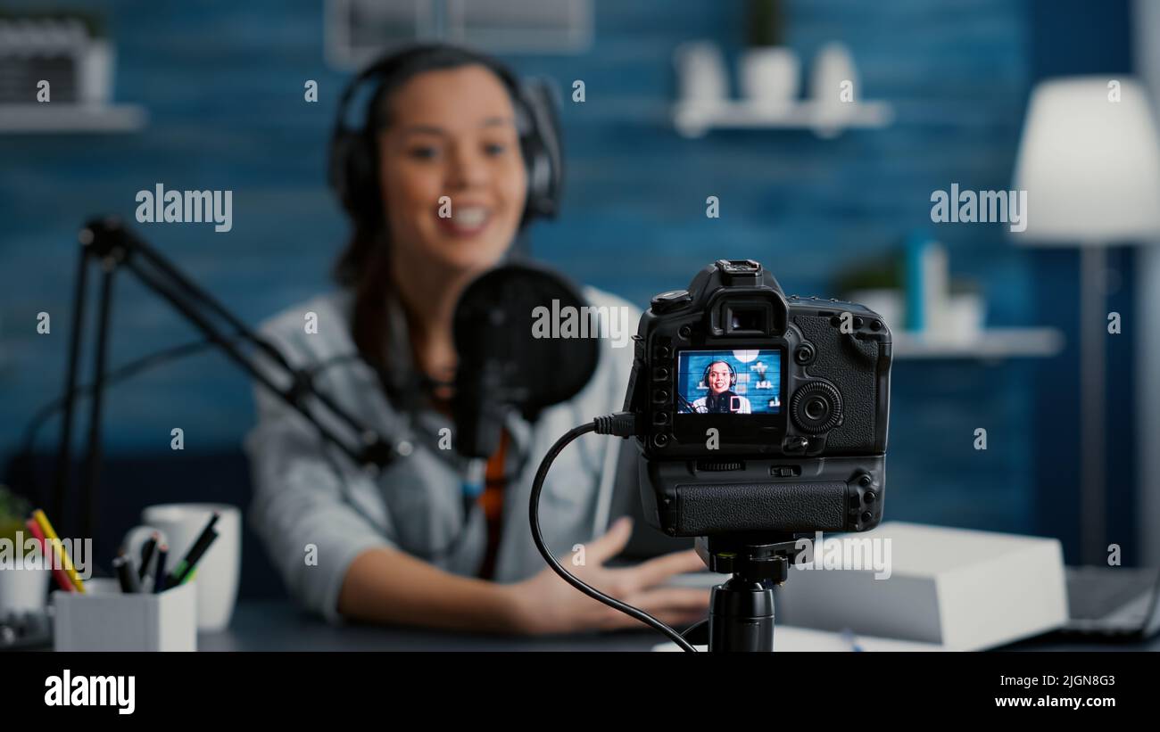 Popular digital content creator doing unboxing vlog of new smartphone. Creative young influencer ...