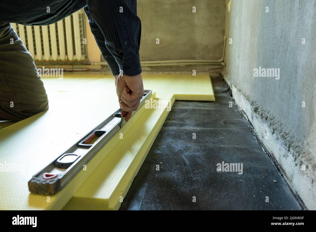 Close-up of the master cuts the size of expanded polystyrene on the ...