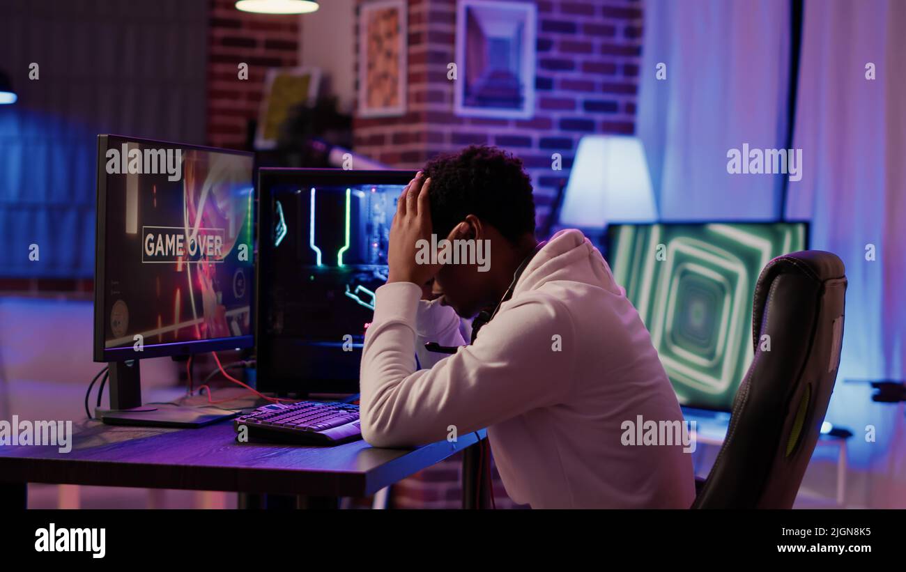 African american man shouting angry after losing online tournament ...