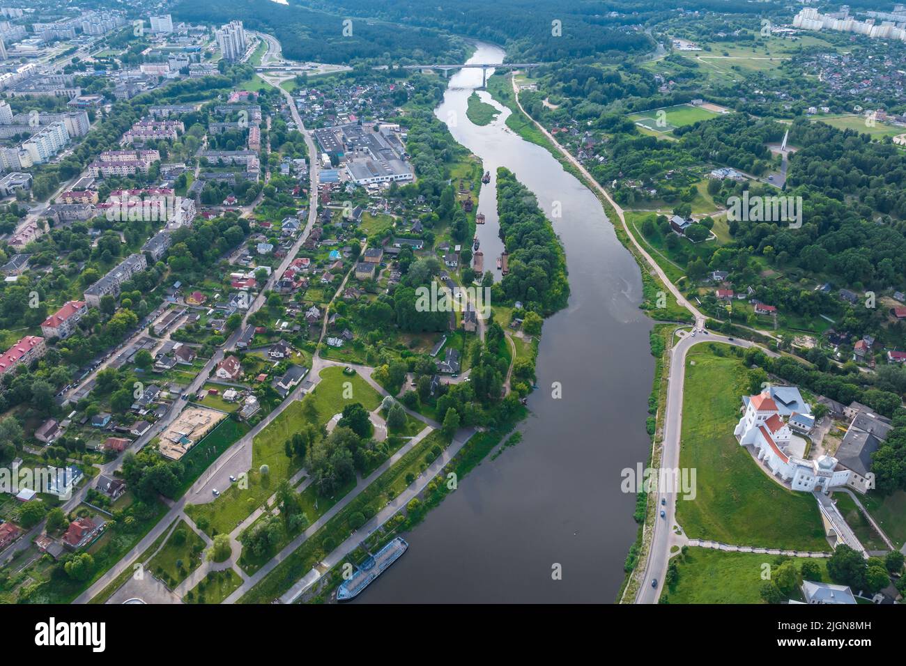 aerial view from great height on wide river and huge bridge of old city ...