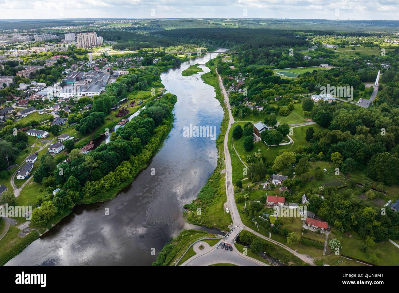 aerial view from great height on wide river and huge bridge of old city ...
