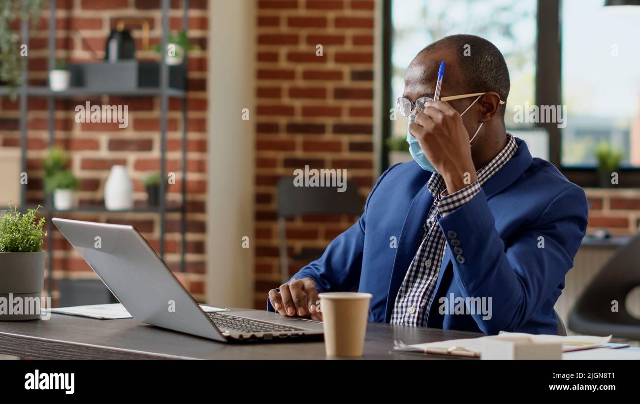 Thoughtful worker brainstorming ideas to create project plan with ...