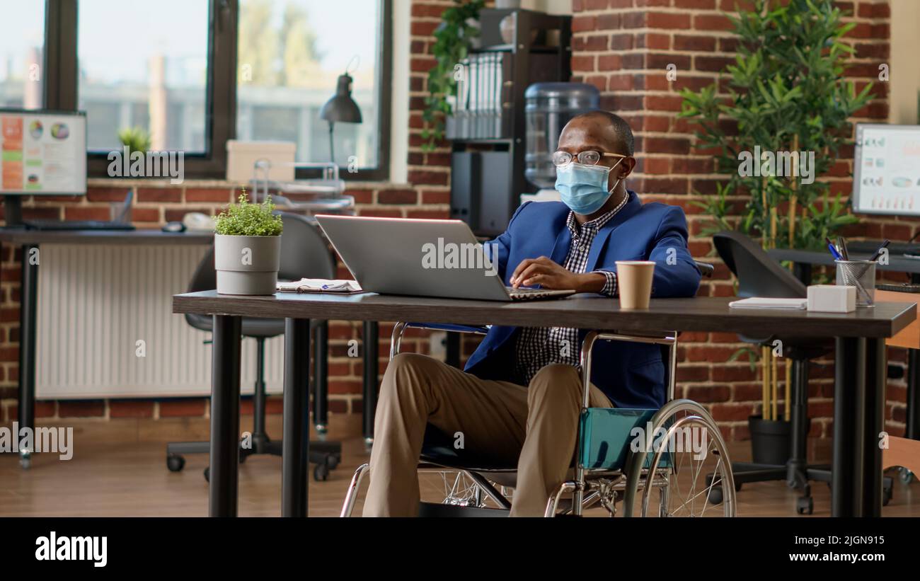 Businessman with chronic disability planning startup strategy during ...