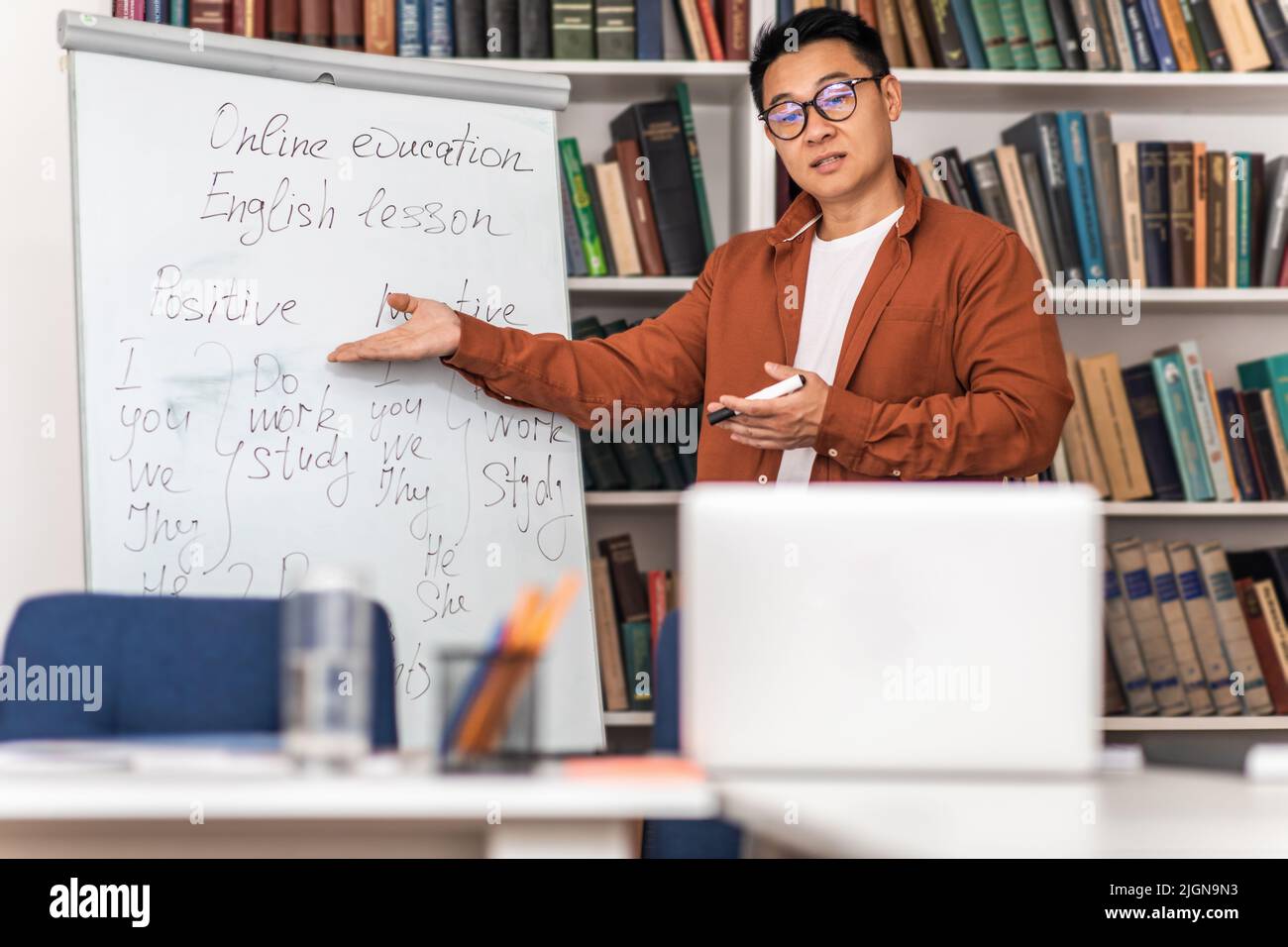 Asian Teacher Teaching Online Having Remote Class Standing At Workplace ...