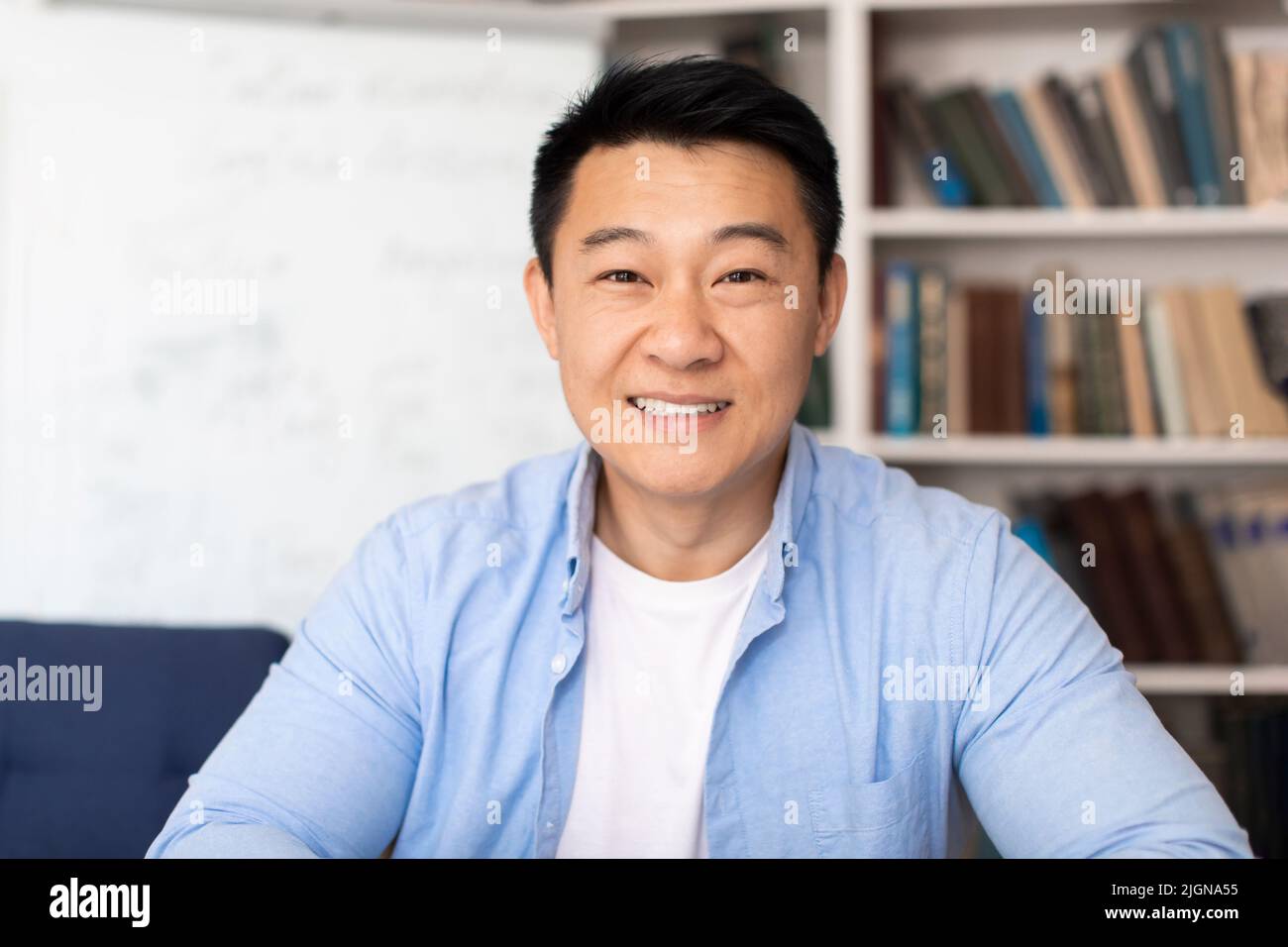 Portrait Of Asian Teacher Man Posing Near Whiteboard In Classroom Stock ...