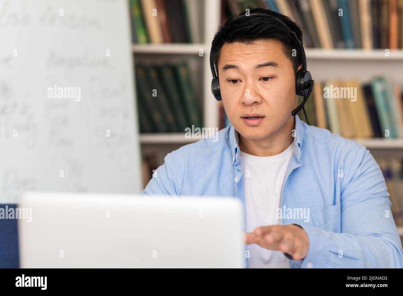 Asian man making video call hi-res stock photography and images - Alamy