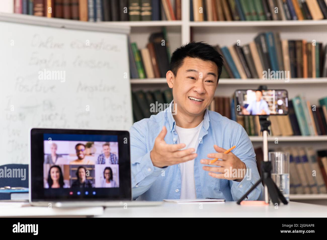 Korean Teacher Man Making Video Call Teaching Online At Workplace Stock ...