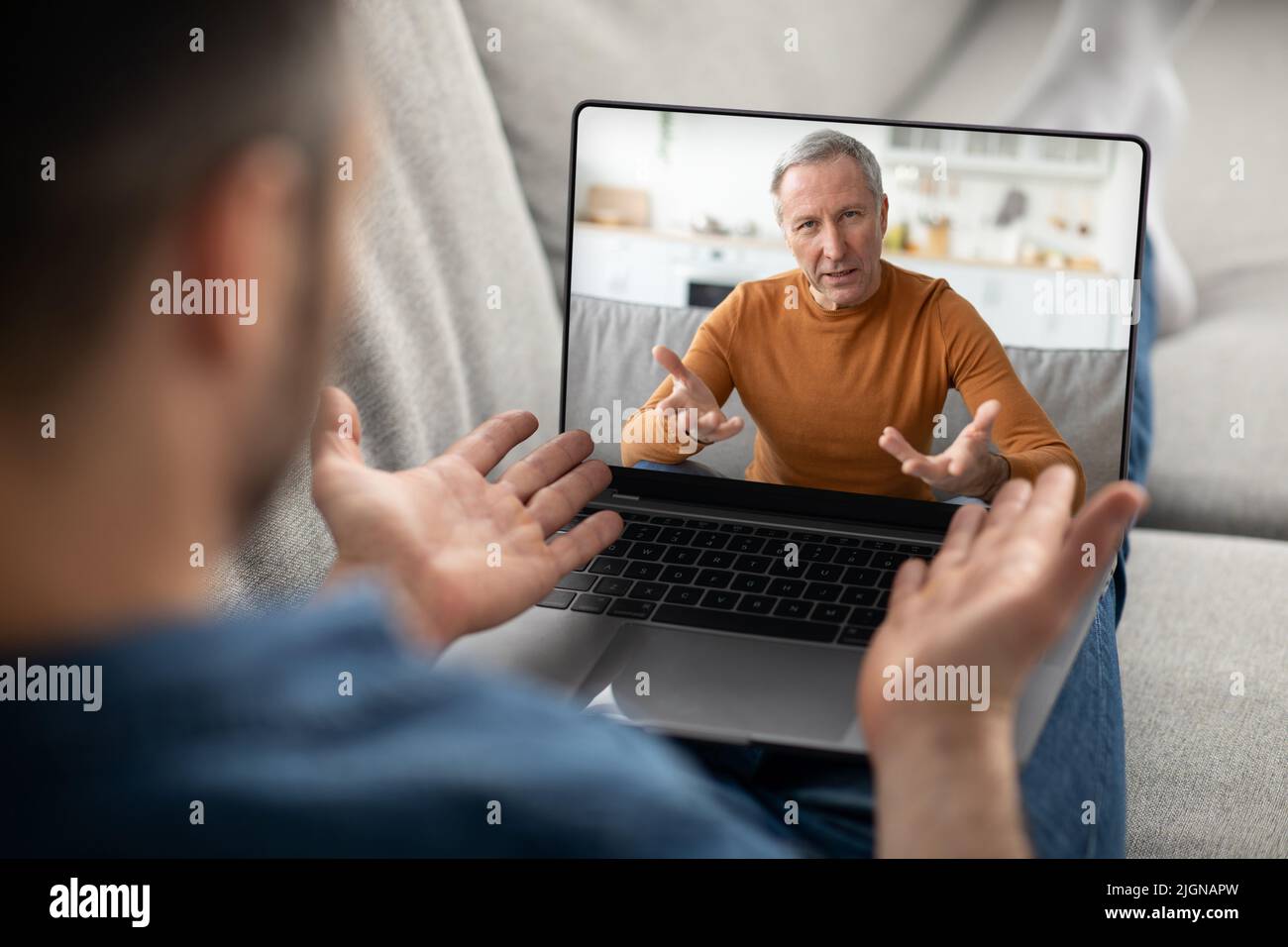 Couple talking over remote work hi-res stock photography and images - Alamy