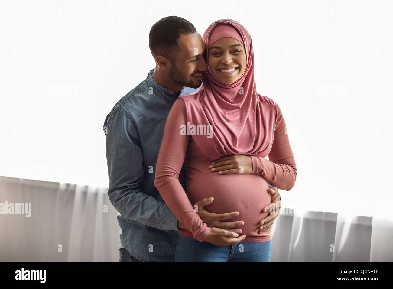 Portrait Of Loving Happy Black Islamic Spouses Expecting Baby Posing At ...
