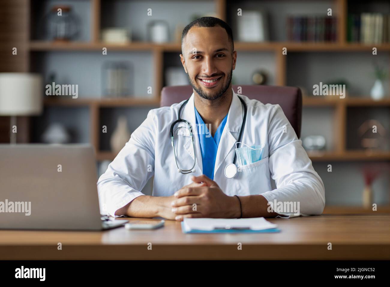 Doctor arab man in white robe with stethoscope at workplace Stock Photo ...