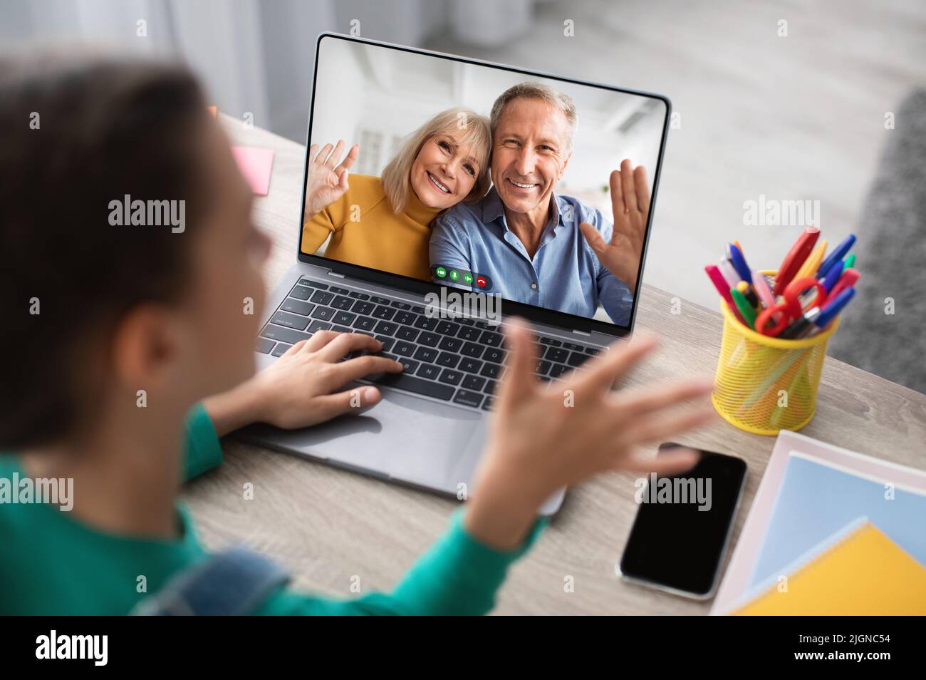 Little Girl Making Video Call To Grandparents Via Laptop At Home Stock ...