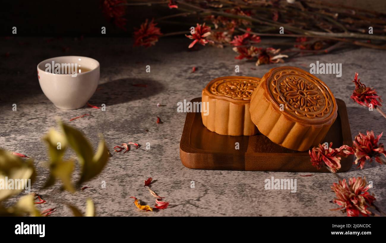 Chinese moon cake for Mid Autumn Festival on rustic stone background ...