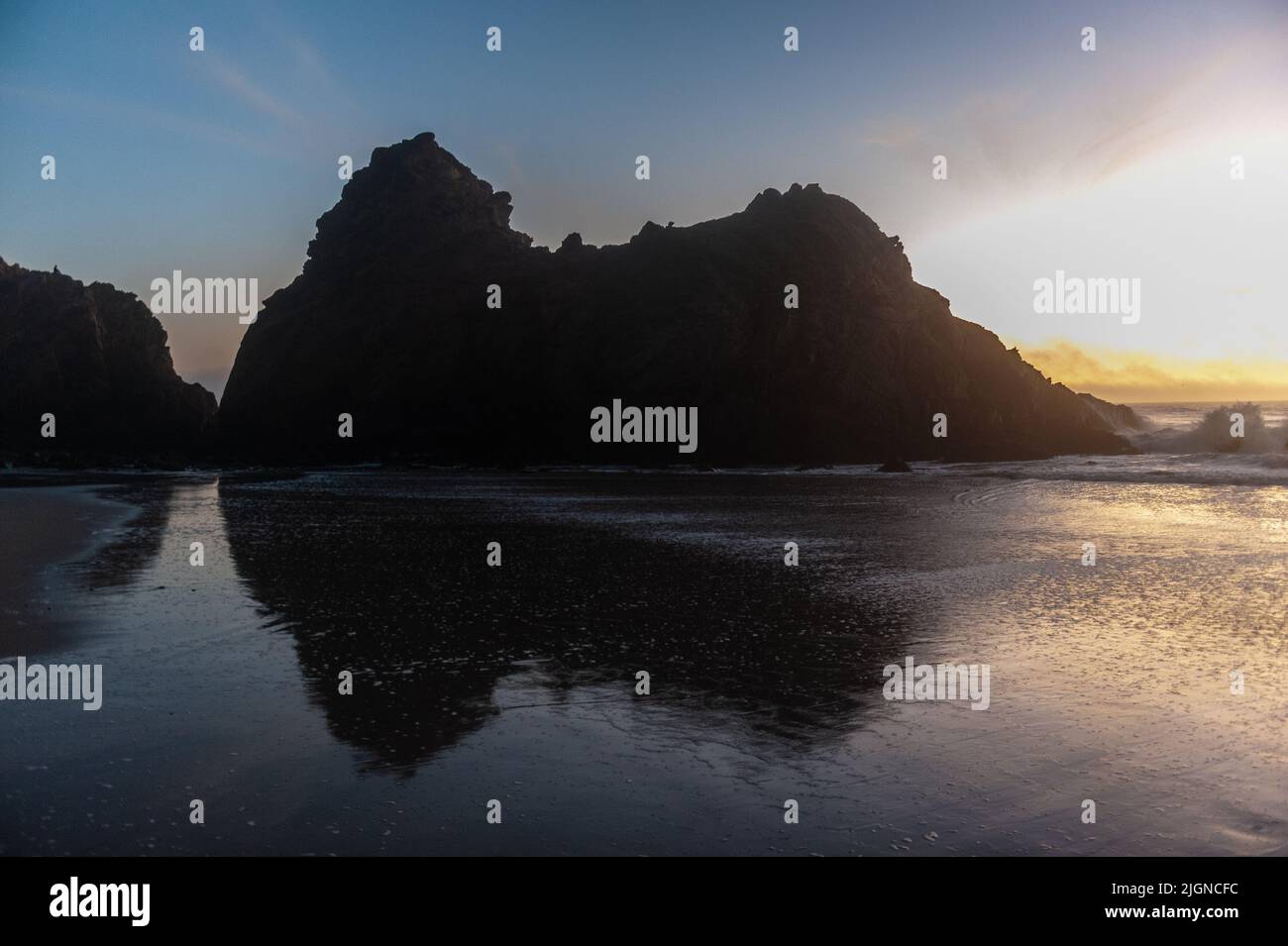 Impression of the keyhole arch rock at Pfeiffer beach around sunset ...