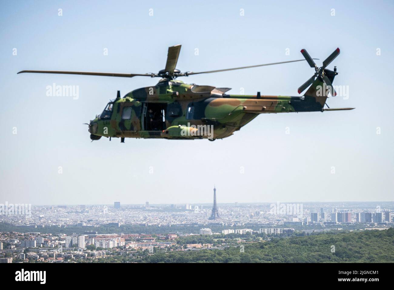A NHIndustries NH90 multi-role military helicopter flies above Paris ahead of the Bastille Day ...
