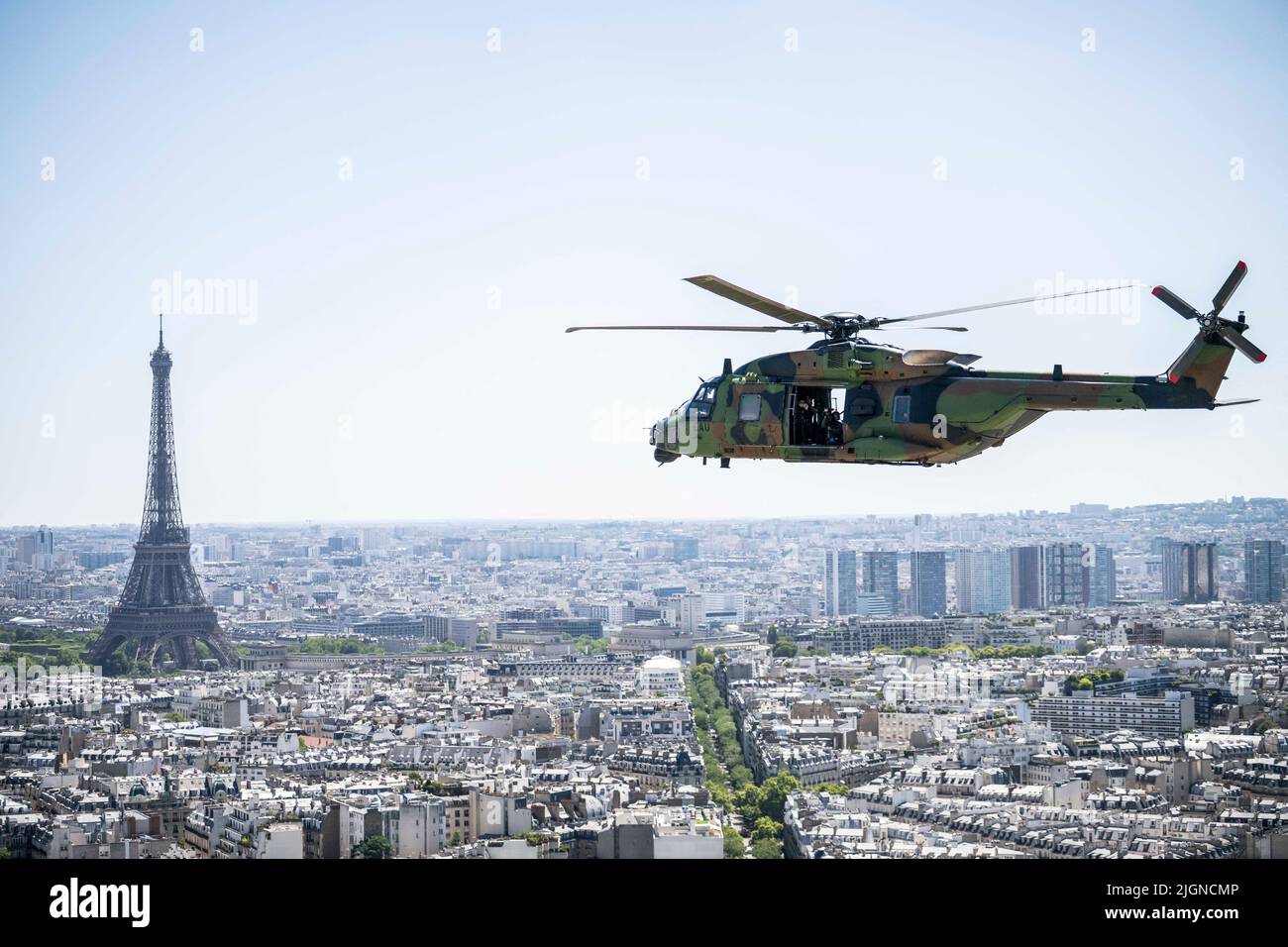 A NHIndustries NH90 multi-role military helicopter flies above Paris ahead of the Bastille Day ...