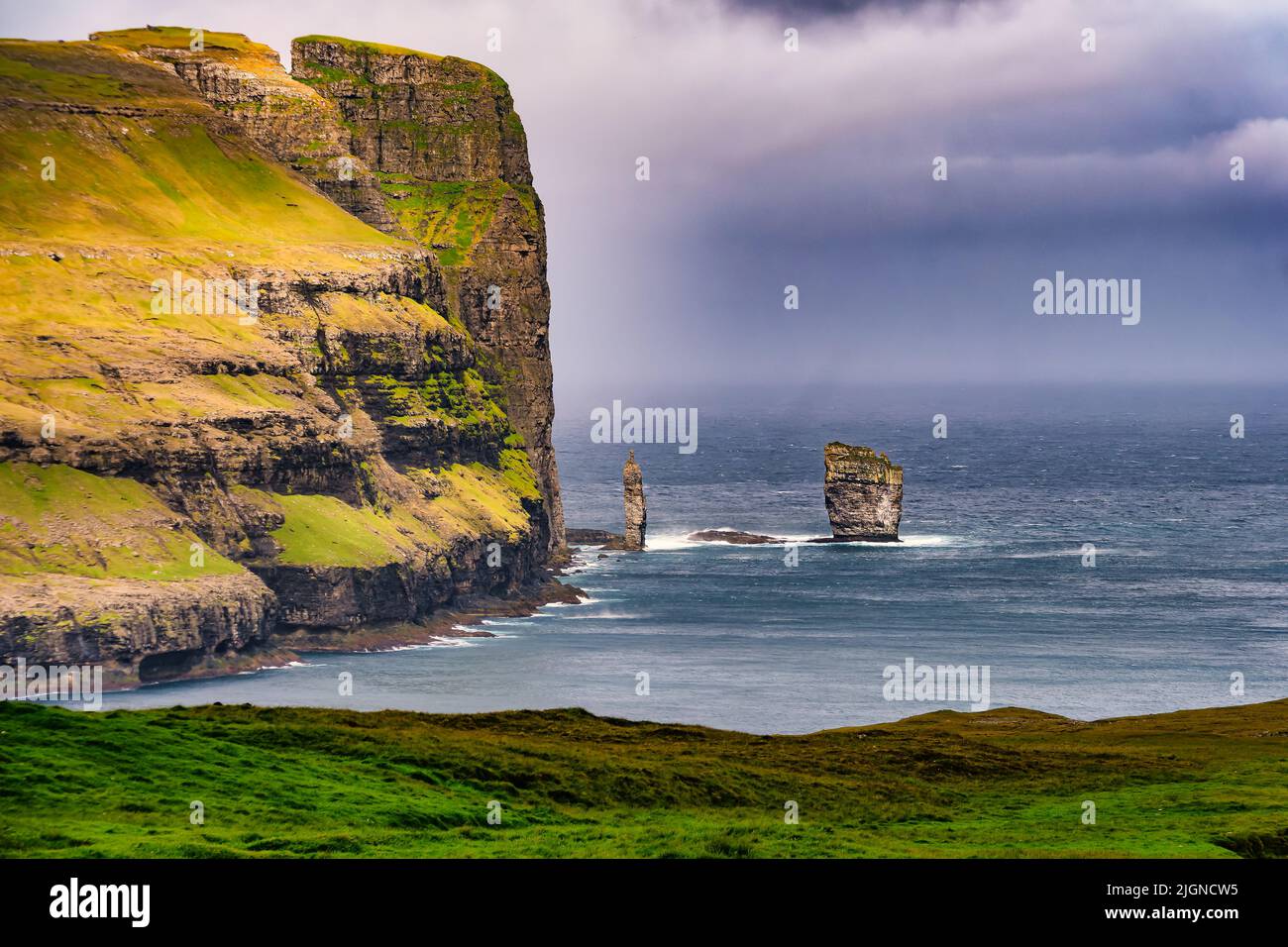 Risin og Kellingin rock formations on the coast of Eysturoy Island ...
