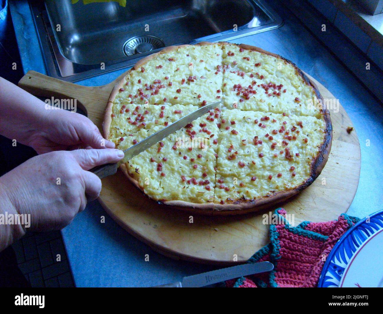 Homemade traditional delicious onion pie garnish with dice of smoked ...