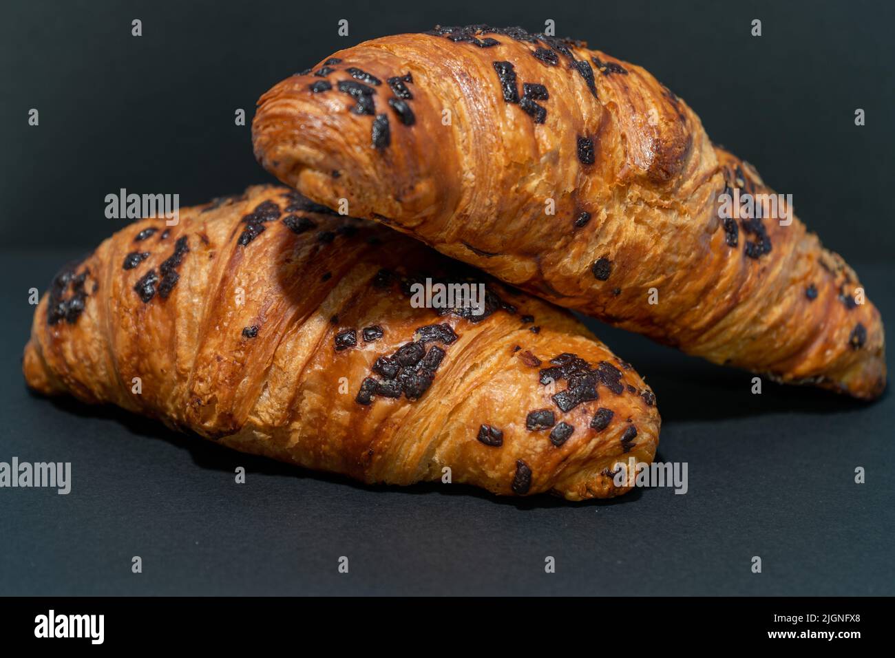 Croissant black background Stock Photo - Alamy