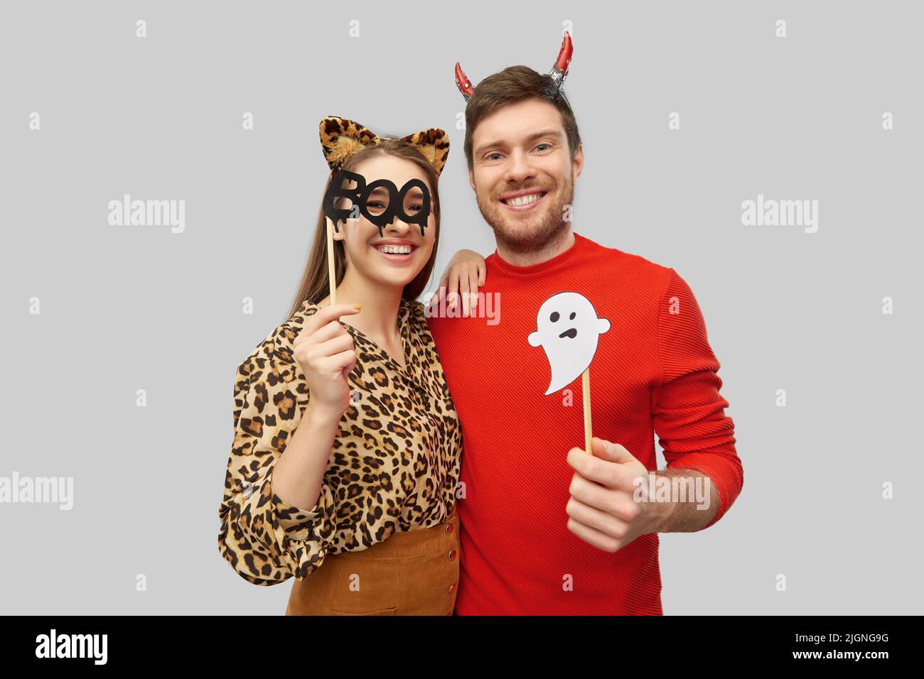 couple in halloween costumes of devil and leopard Stock Photo - Alamy