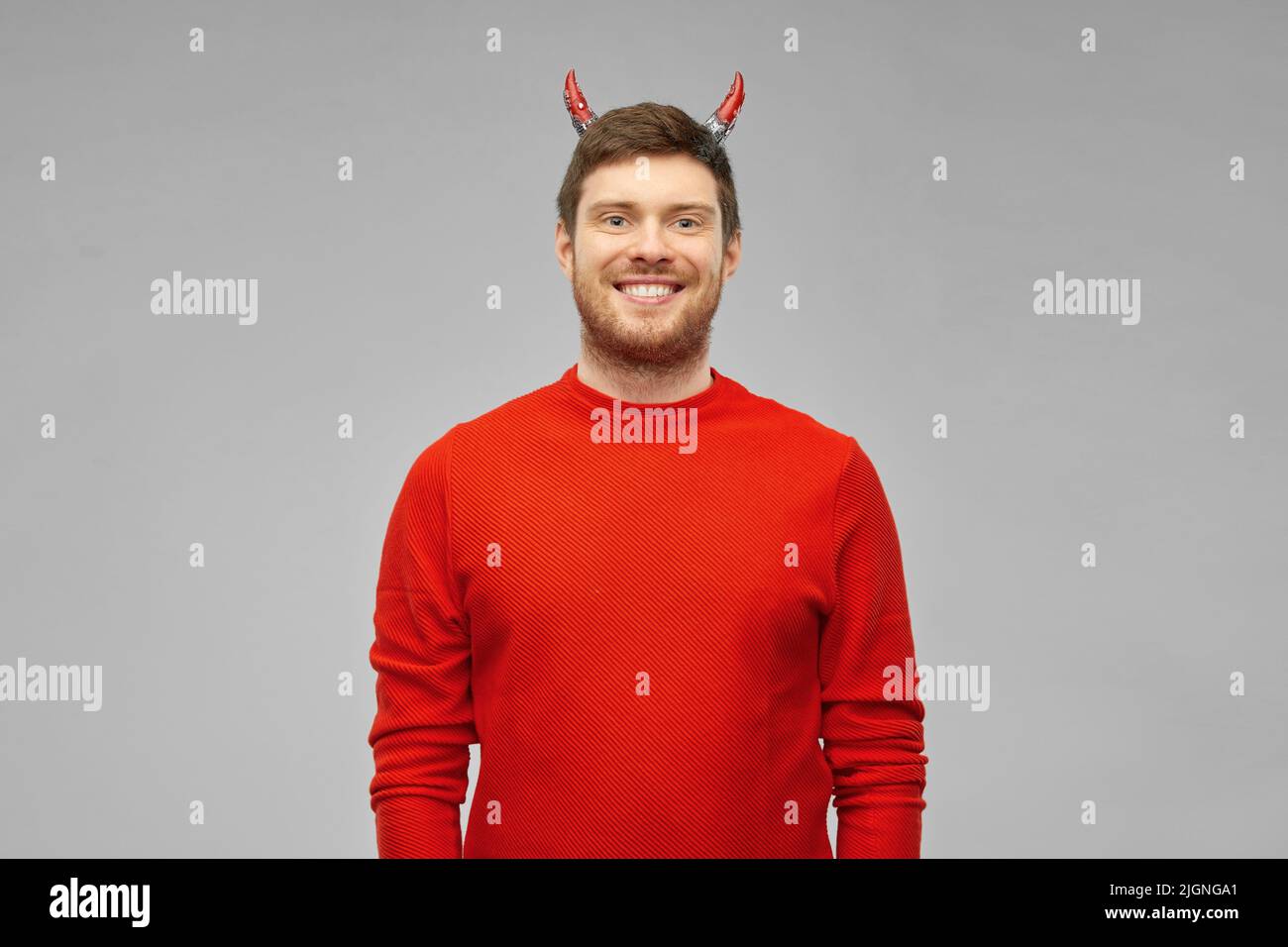 happy man in halloween costume of devil over grey Stock Photo - Alamy