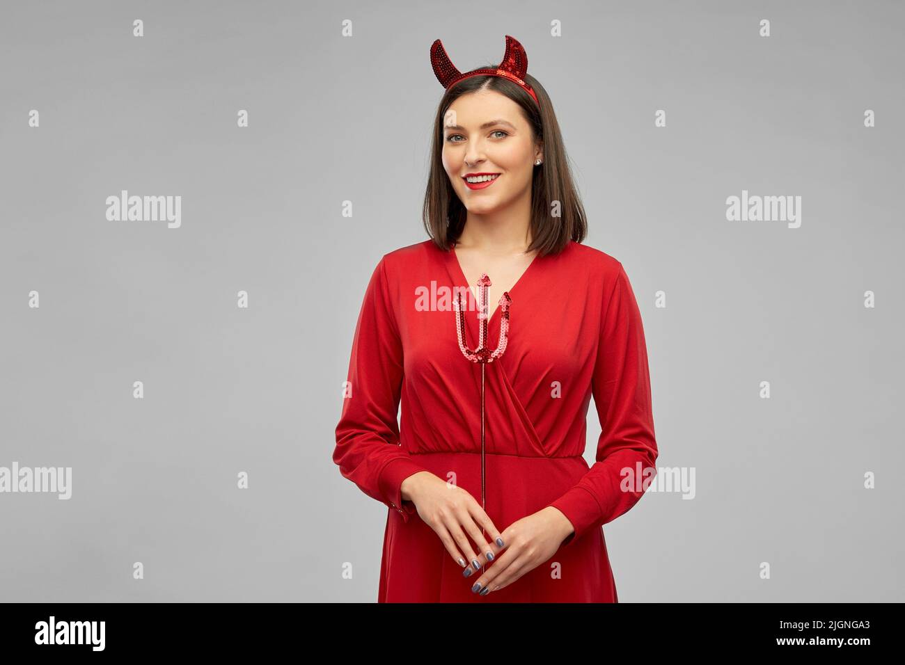 Woman red dress devil hi-res stock photography and images - Alamy