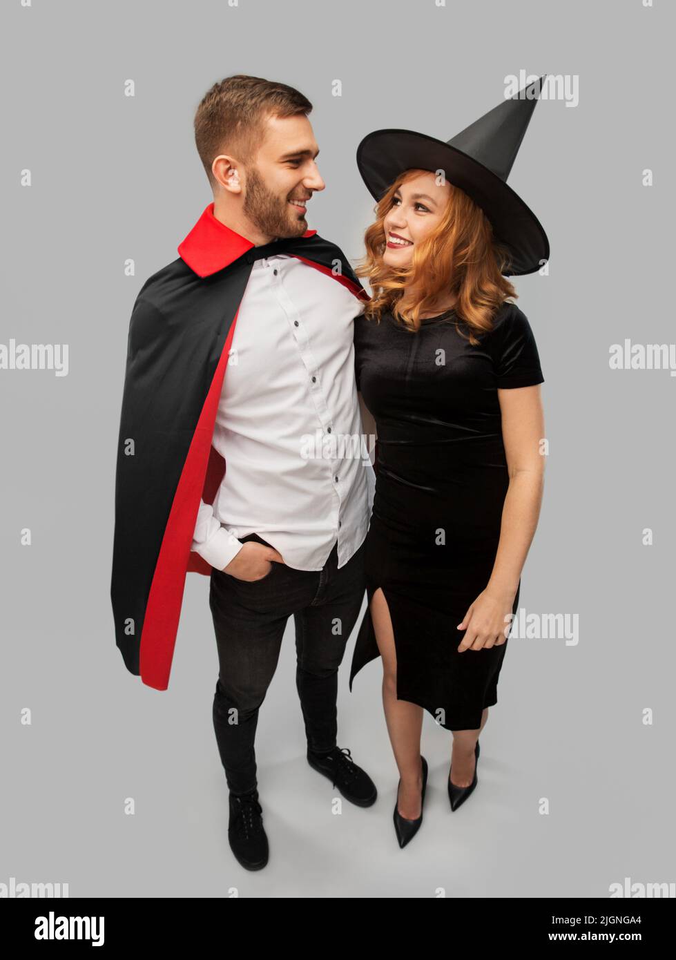 couple in halloween costumes of witch and vampire Stock Photo - Alamy
